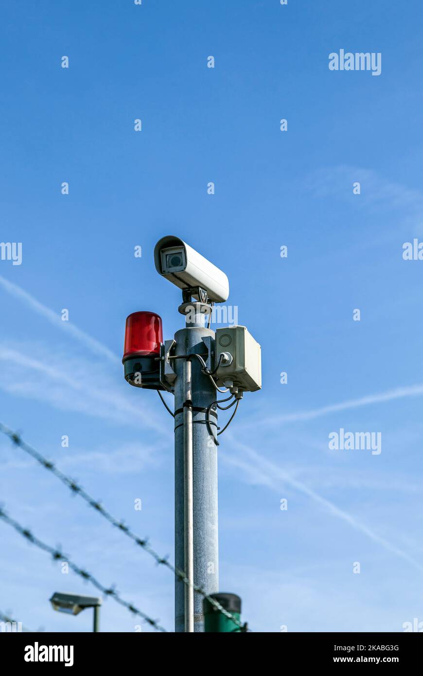 CCTV security camera under blue sky Stock Photo - Alamy