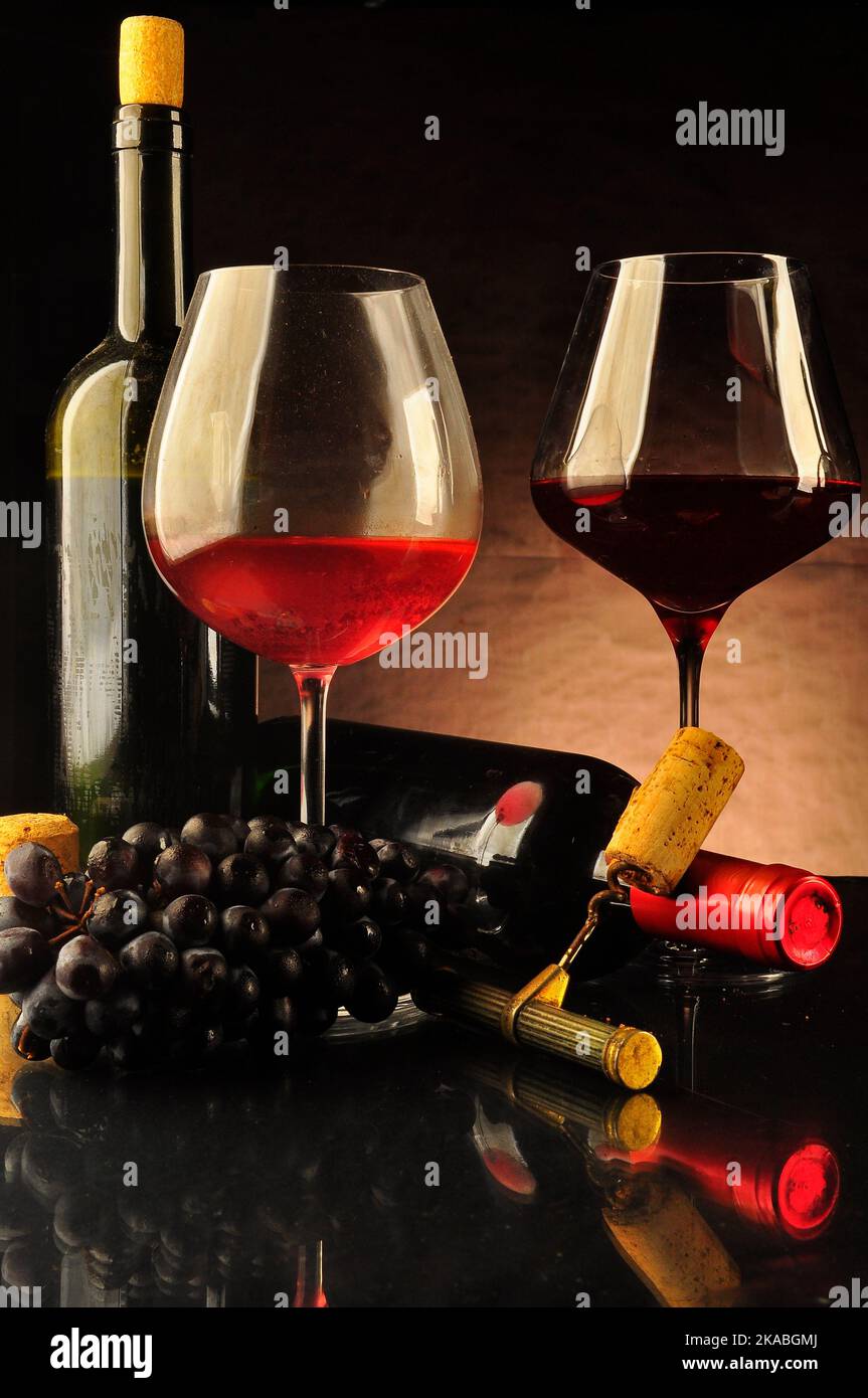 Glass and bottle of wine on the table Stock Photo - Alamy
