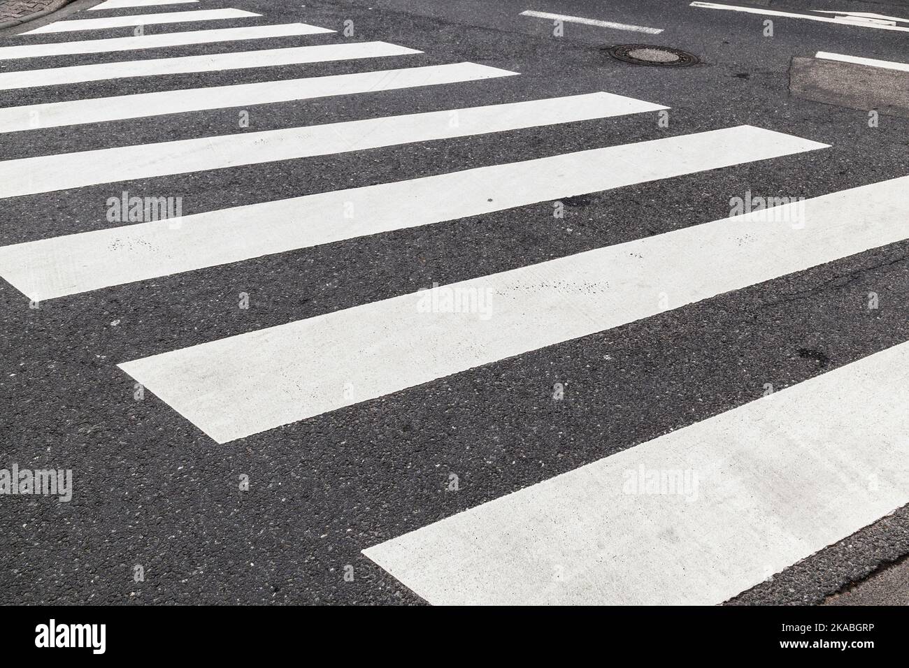 pedestrian crossing marked with white paint Stock Photo - Alamy