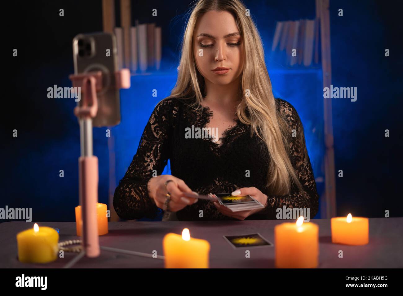 Tarot reader picking tarot cards who lie face down on table near ...
