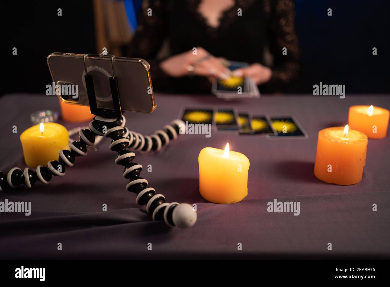 Psychic with smartphone, tarot cards reading. esoteric concept. fortune ...