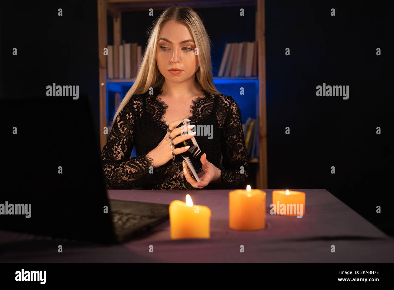 Modern technology. Beautiful professional fortune teller holding a ...