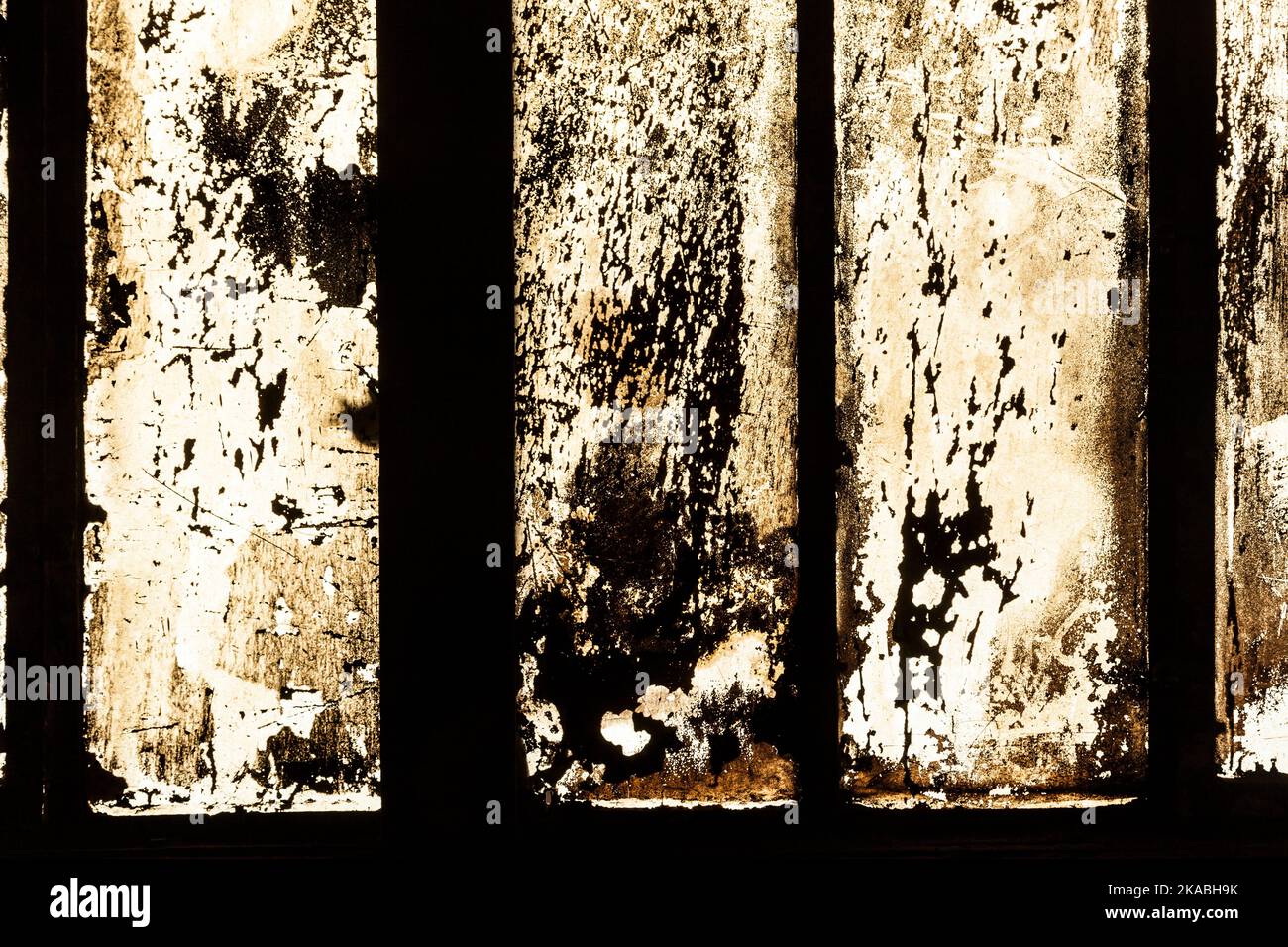 grungy window with carbon black symbolizes the dirt of iron works ...