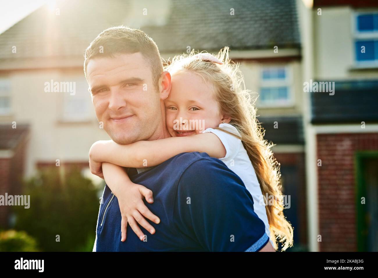 Day out with me and daddy. Portrait of a cheerful young father giving ...