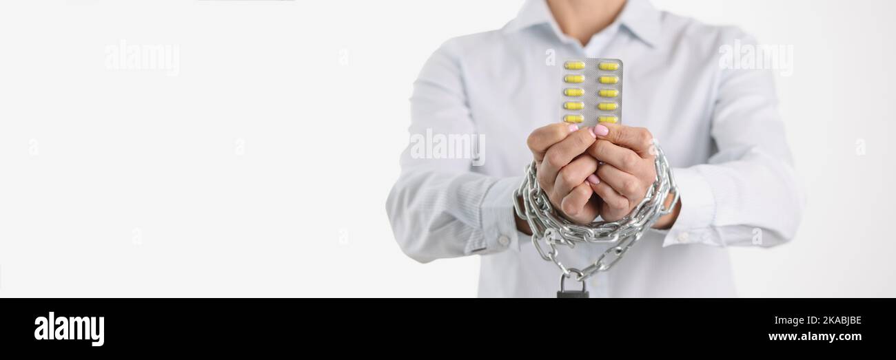 Addictive woman taking too many drugs with chain Stock Photo - Alamy
