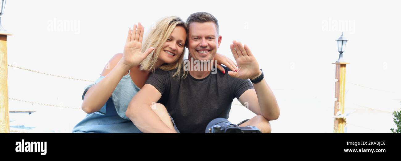 Happy bloggers are filming welcome video on camera in nature Stock ...