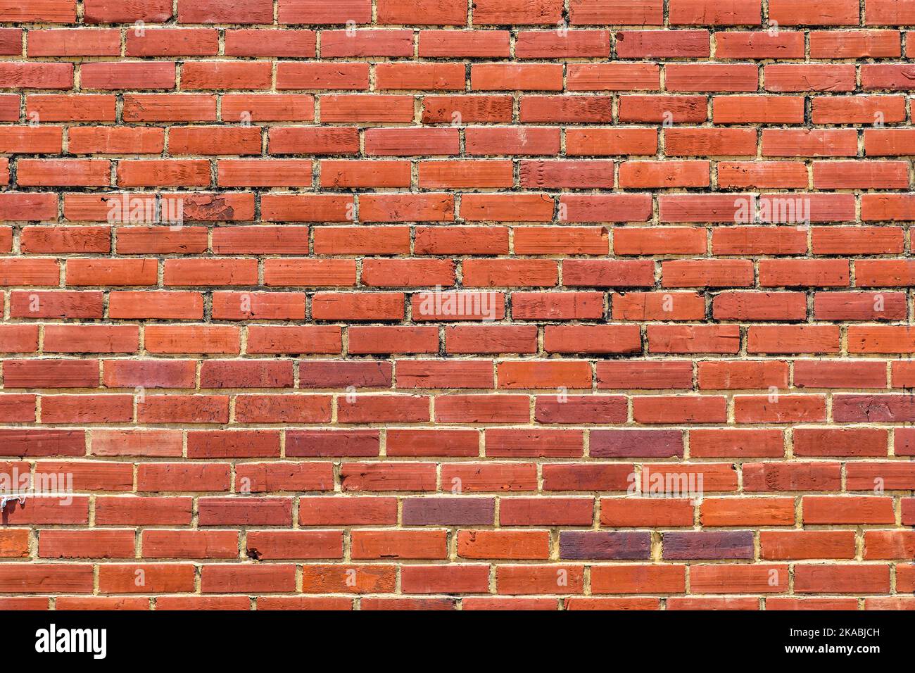 Red bricks wall as background front view closeup Stock Photo - Alamy