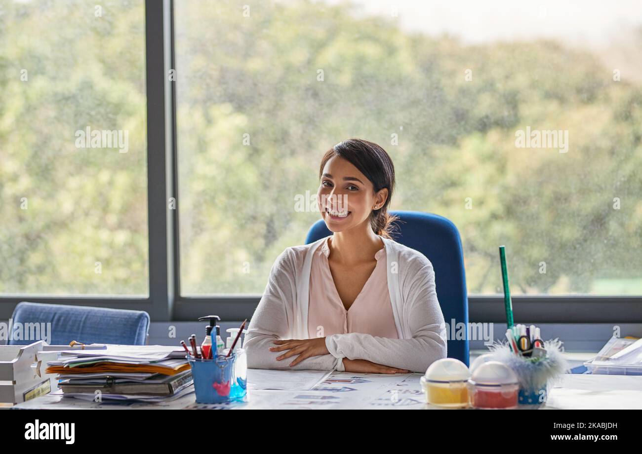 She has her dream occupation. young female teacher in a classroom Stock ...
