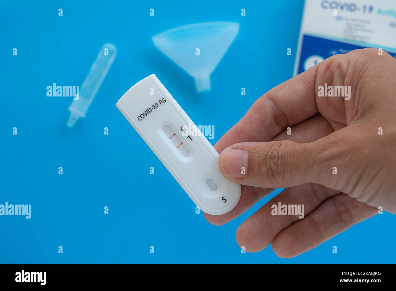 Making Coronavirus antigen test with positive result Stock Photo - Alamy