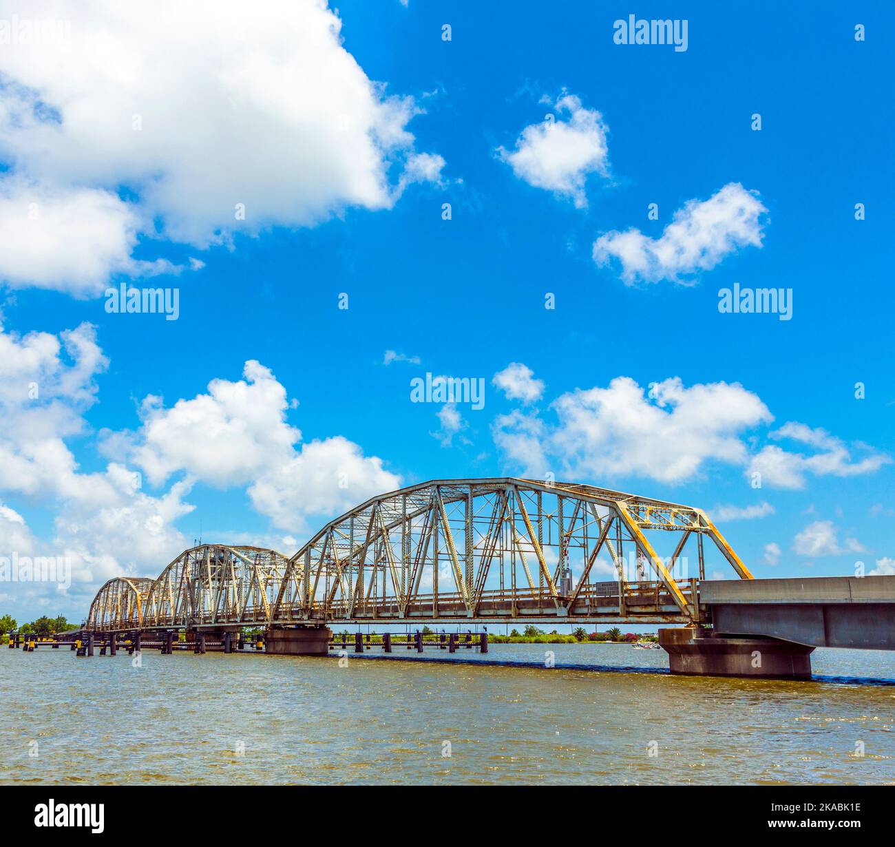 driving on Chef Menteur Highway with old bridge in East area of New ...