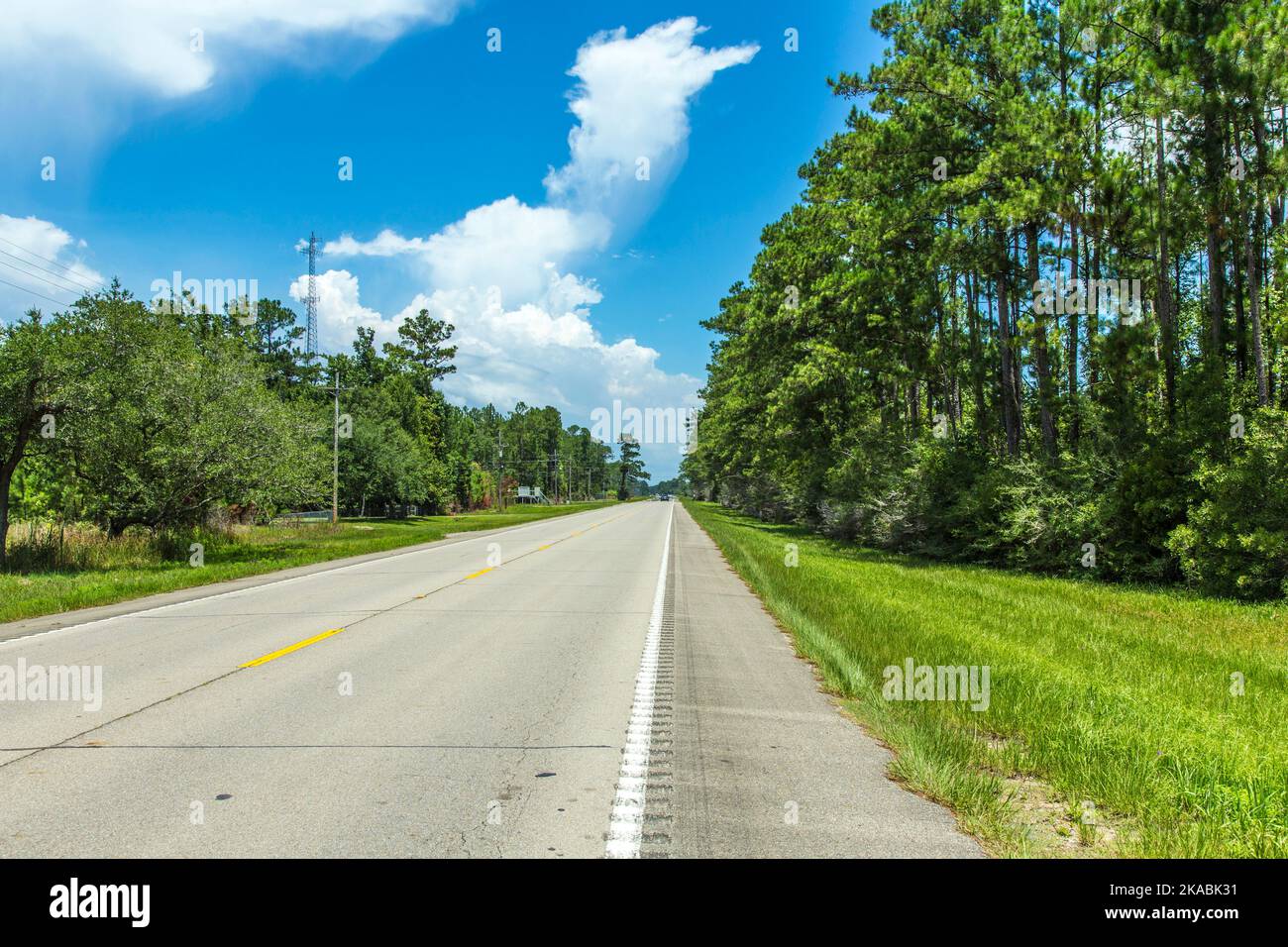 empty highway in america with trees and blue sky - travel symbol Stock ...
