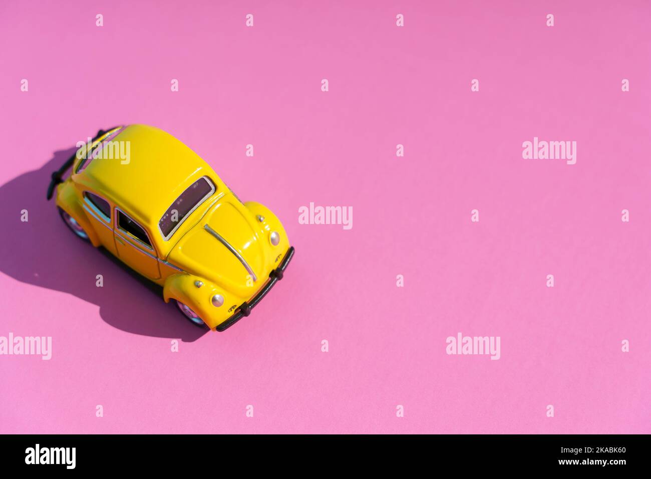 Travel car concept background. Yellow toy car on empty minimal pastel ...