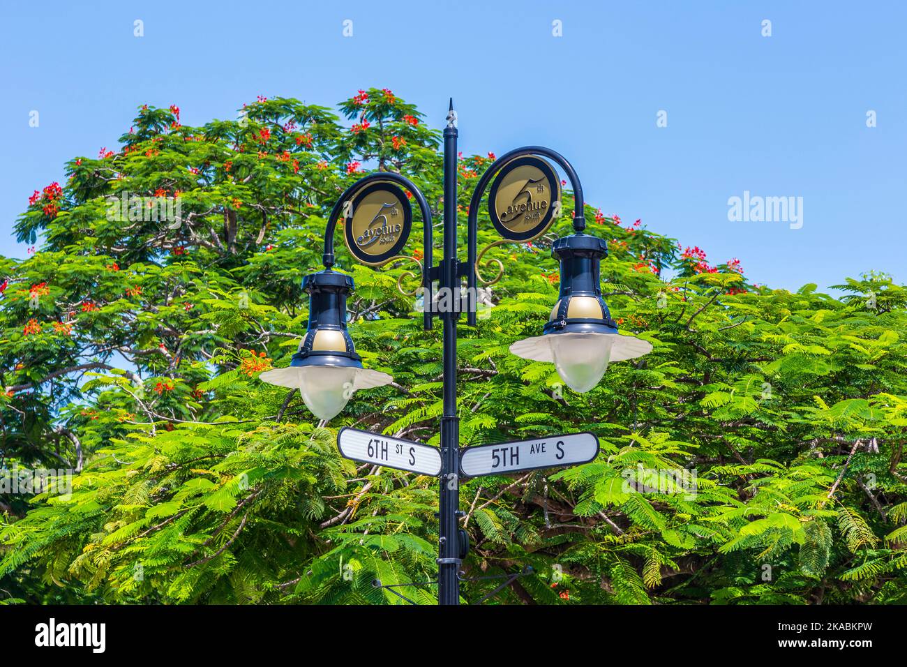 historical street sign 5th avenue in Naples, Florida under blue sky ...