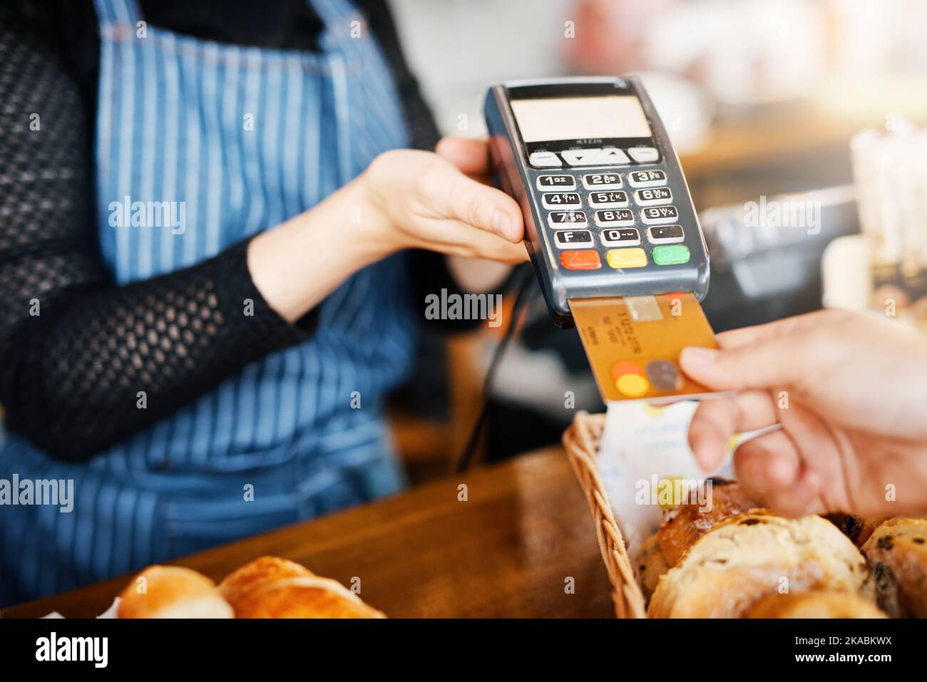 Straight or budget. an unrecognizable man paying for his purchase by card Stock Photo - Alamy