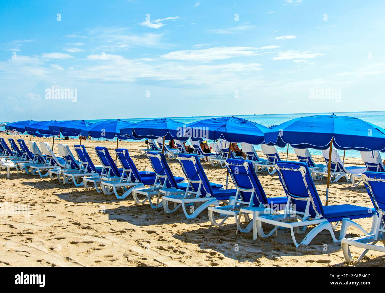 beach umbrella with couch colorful in the sand Stock Photo - Alamy