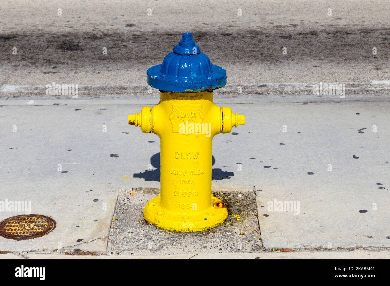 yellow Fire Hydrant at the sidewalk Stock Photo - Alamy