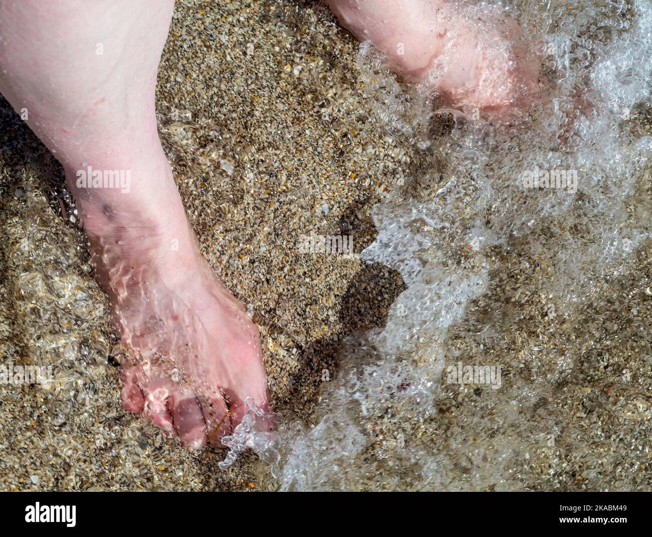 pale female foot at the sandy beach Stock Photo - Alamy