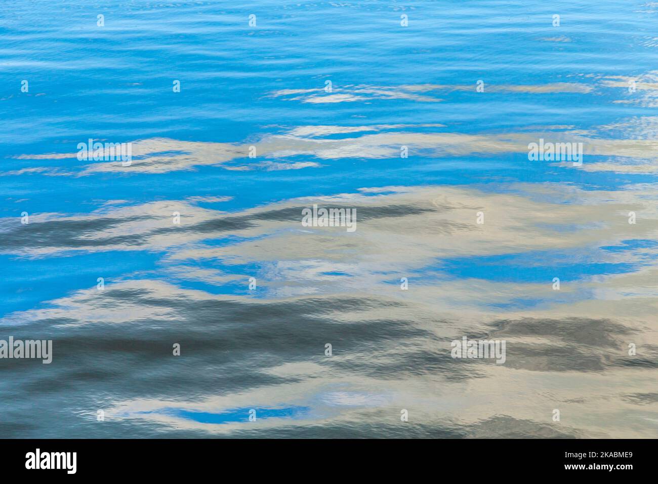 reflection of sky and clouds in the water of the ocean Stock Photo - Alamy