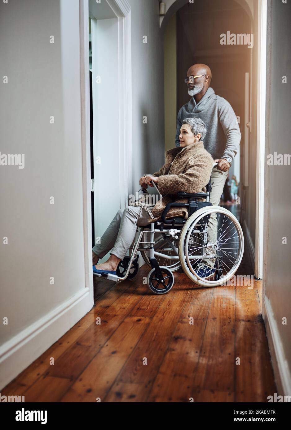Old man pushing wheelchair hi-res stock photography and images - Alamy
