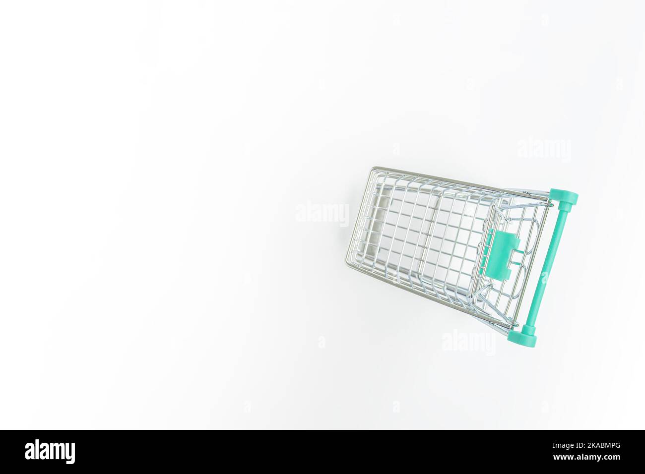 Empty shopping trolley on white background Stock Photo - Alamy