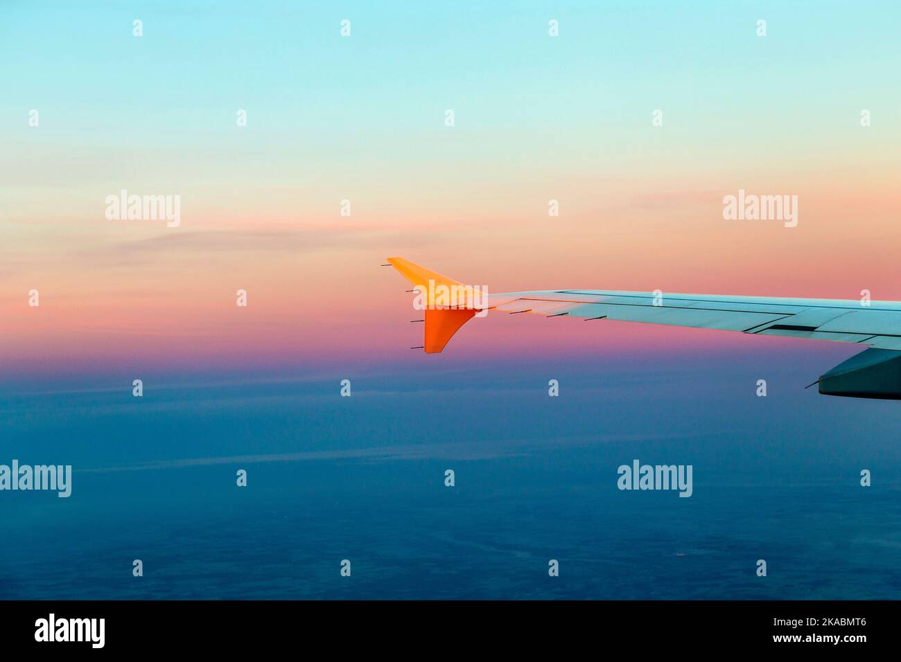 wing of aircraft in the morning sun Stock Photo - Alamy
