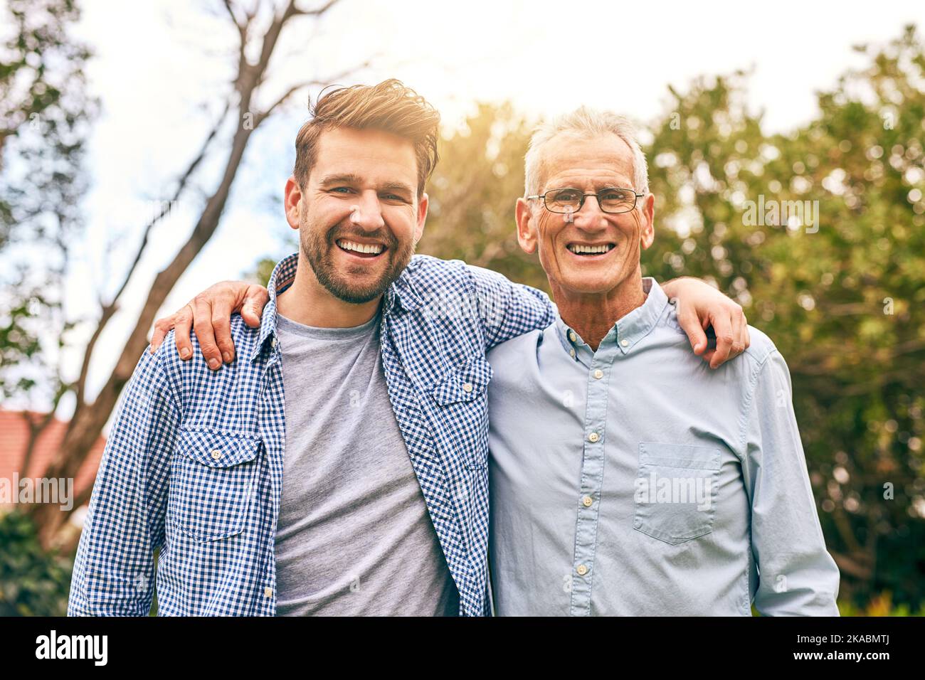 They smile the same. a senior father and his adult son bonding outside ...