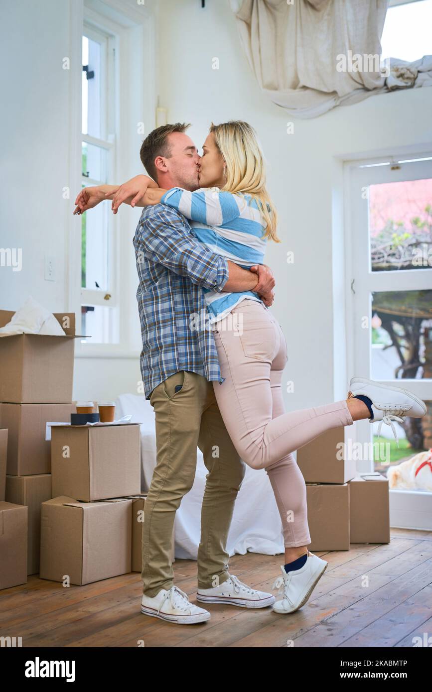 Its a big moment in their lives. a young couple celebrating their move ...