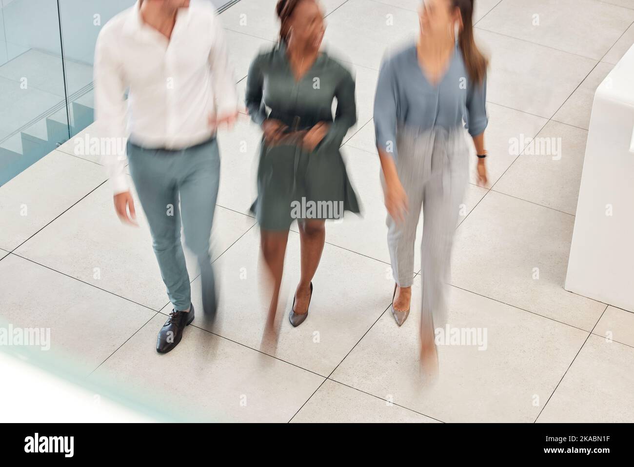 Walking, blurred motion and office with a business man and woman team ...