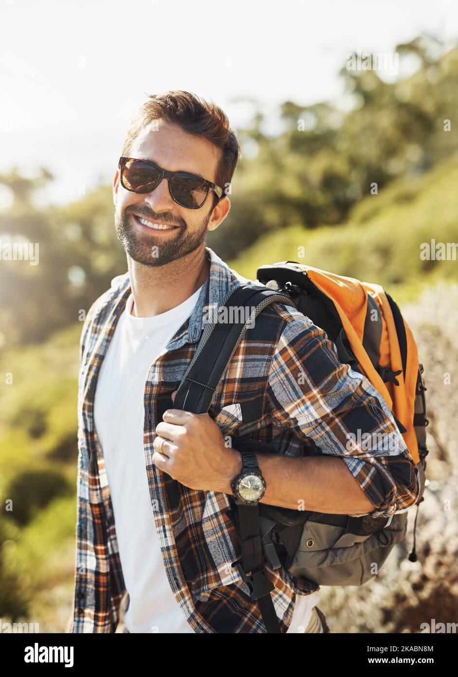 Hiking always puts a smile on my face. Cropped portrait of a handsome ...