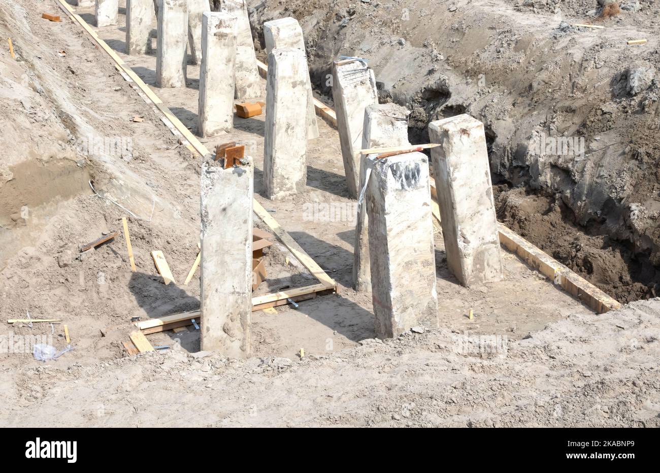Concrete piles foundation for a new building on construction site ...