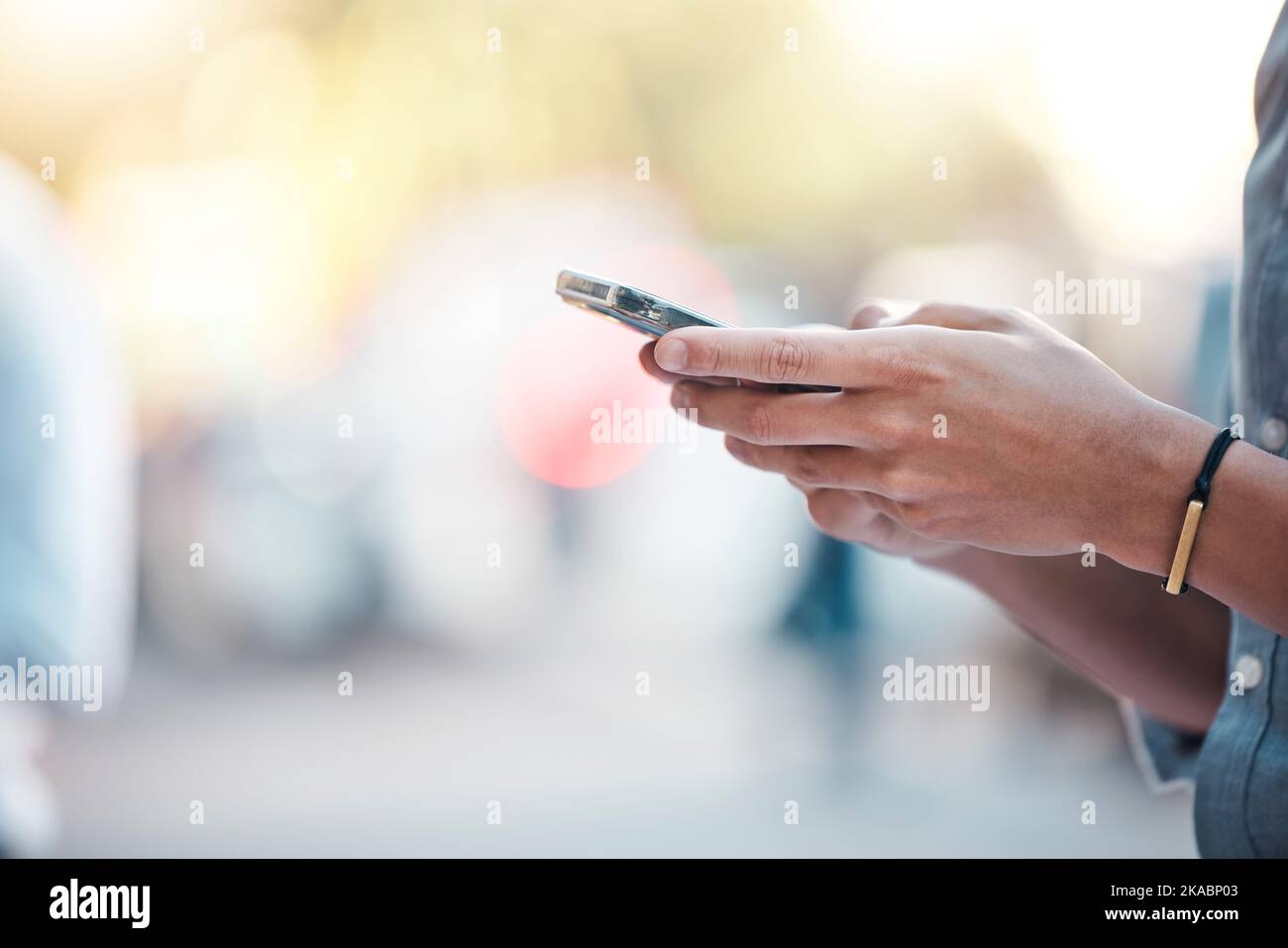 Communication, typing and hands text on phone in city, outdoors and in ...
