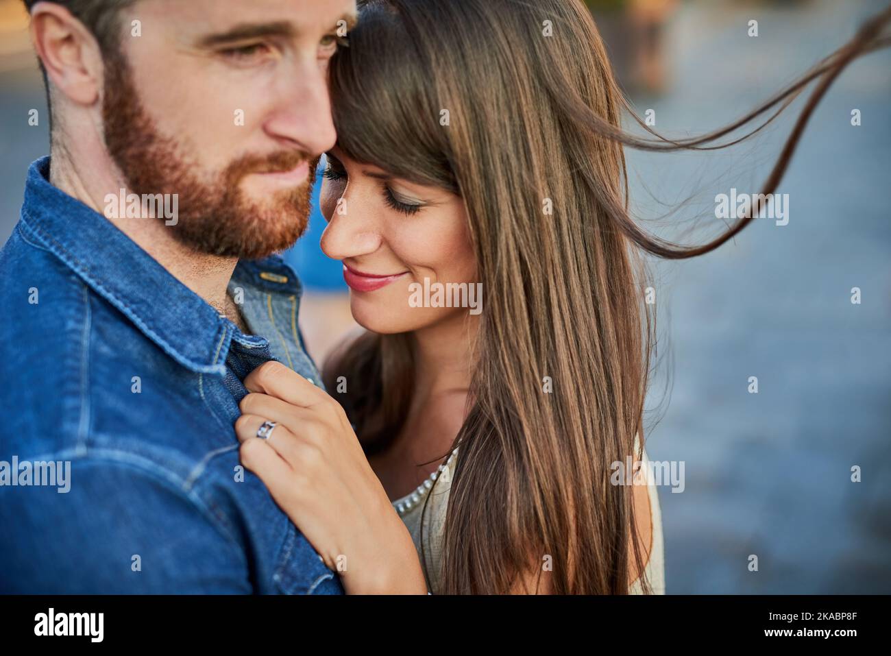 Safe in his arms. High angle shot of an affectionate young couple on a ...