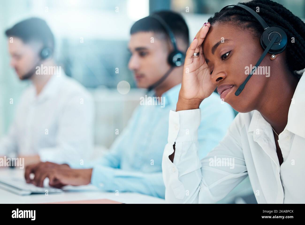 Headache, call center and burnout with a black woman in telemarketing ...