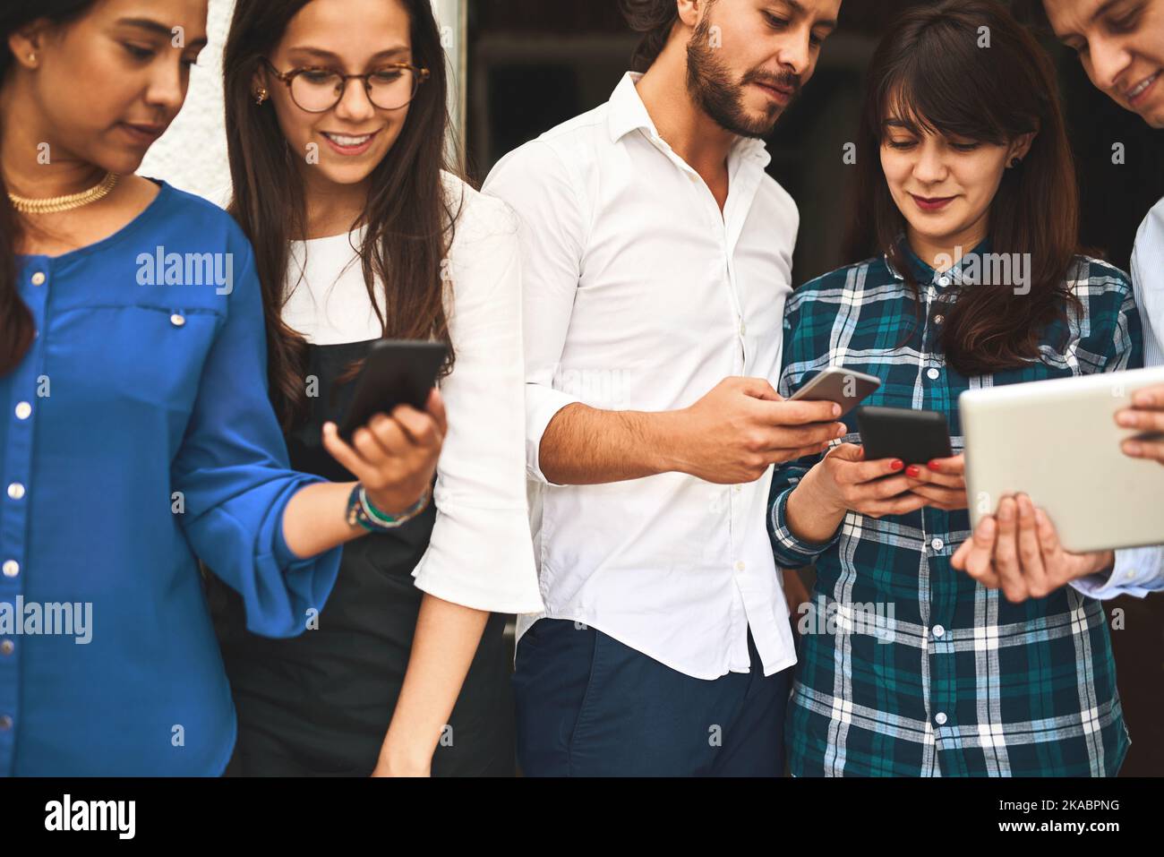 Communicating in all forms. a group of young creative businesspeople ...