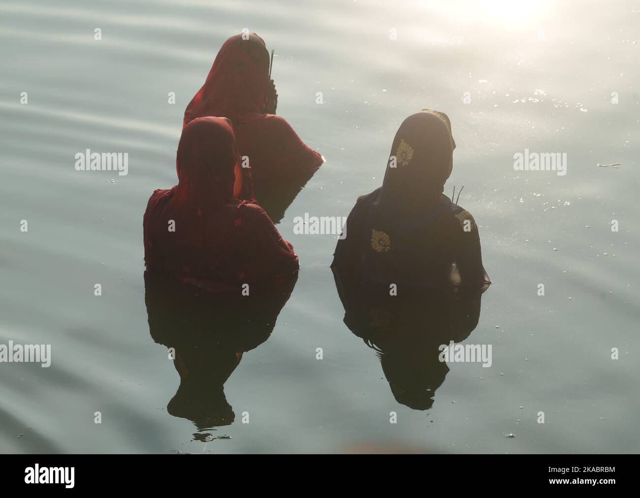 Hindu devotees perform rituals and offer prayers to the Sun God on the ...