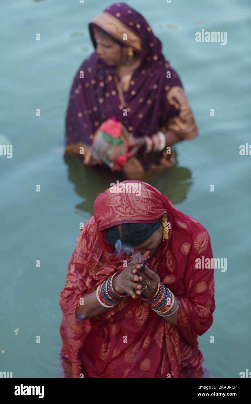Hindu devotees perform rituals and offer prayers to the Sun God on the ...