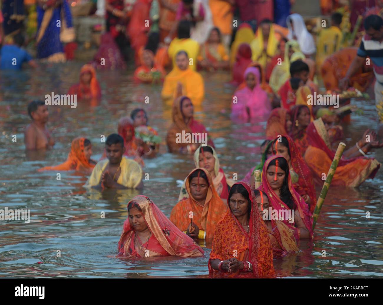 Hindu devotees perform rituals and offer prayers to the Sun God on the ...