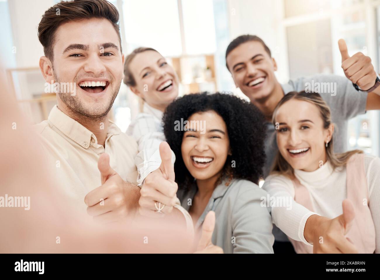 Office selfie, business people and thumbs up for success, trust and teamwork. Vote, thank you ...