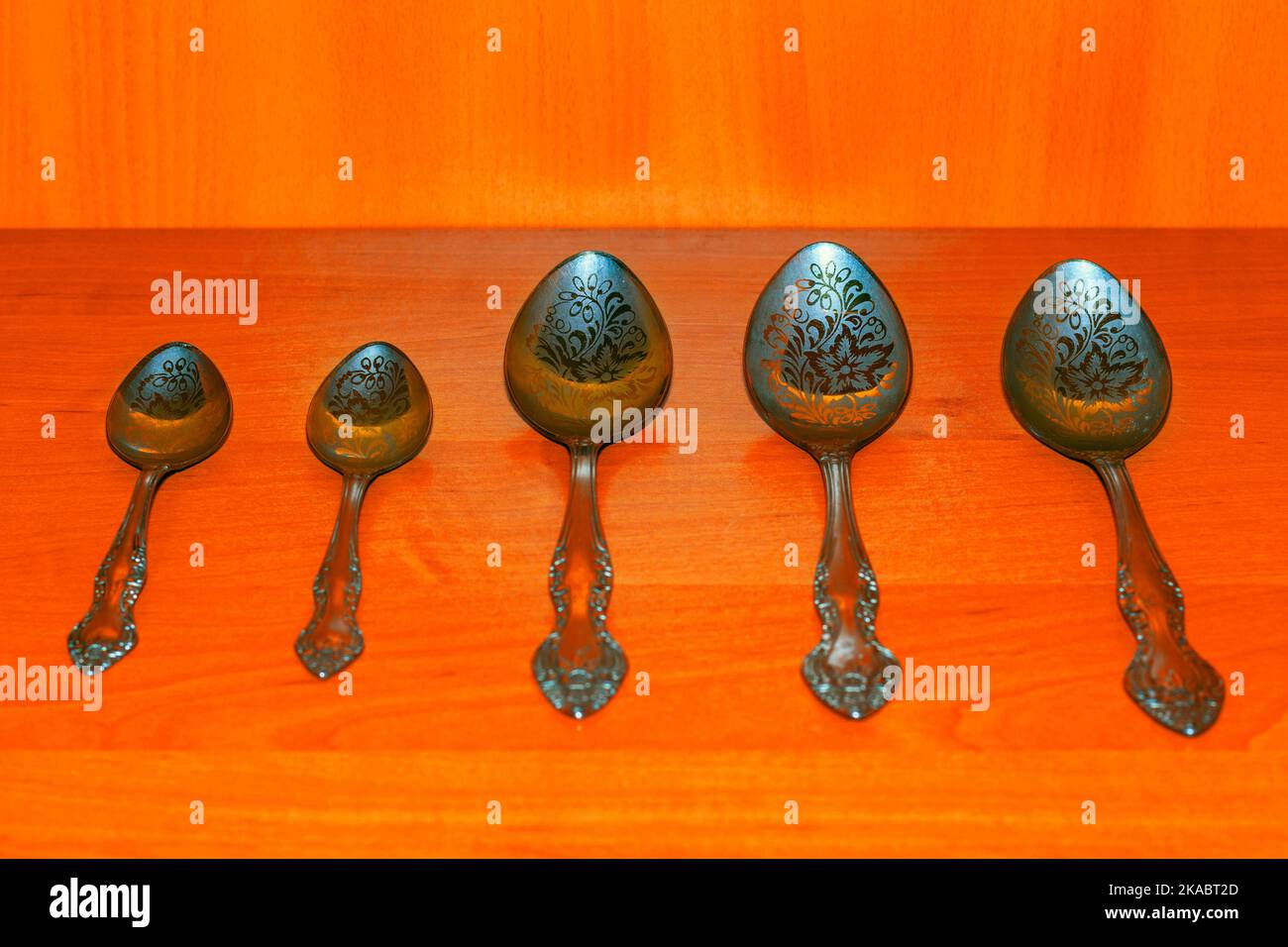 Spoons with different sizes hi-res stock photography and images - Alamy
