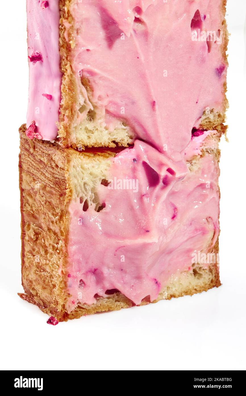 Sliced puff pastry cube shaped croissant with berry custard cream ...