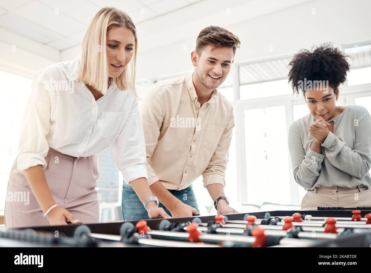 Business people, foosball table and competition in office for team ...