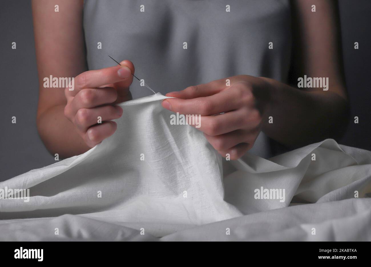Woman sewing traditional cloth hi-res stock photography and images - Alamy