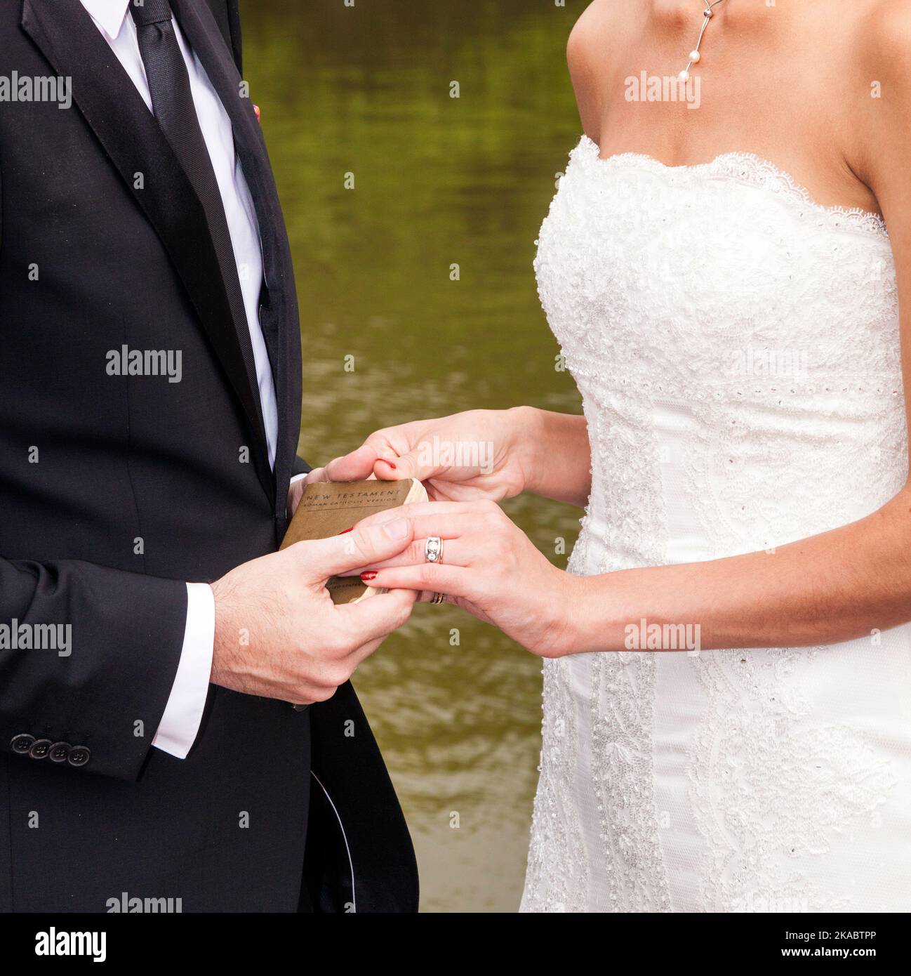 wedding couple are swearing lifetime loyality in the park in the ...
