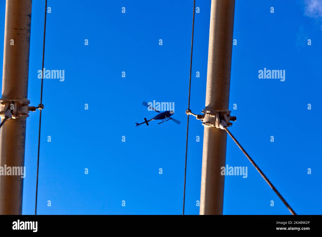 helicopter overflying famous Brooklyn Bridge in New York Stock Photo ...