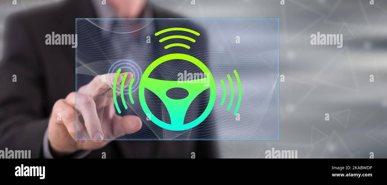 Man touching a self-driving car concept on a touch screen with his ...