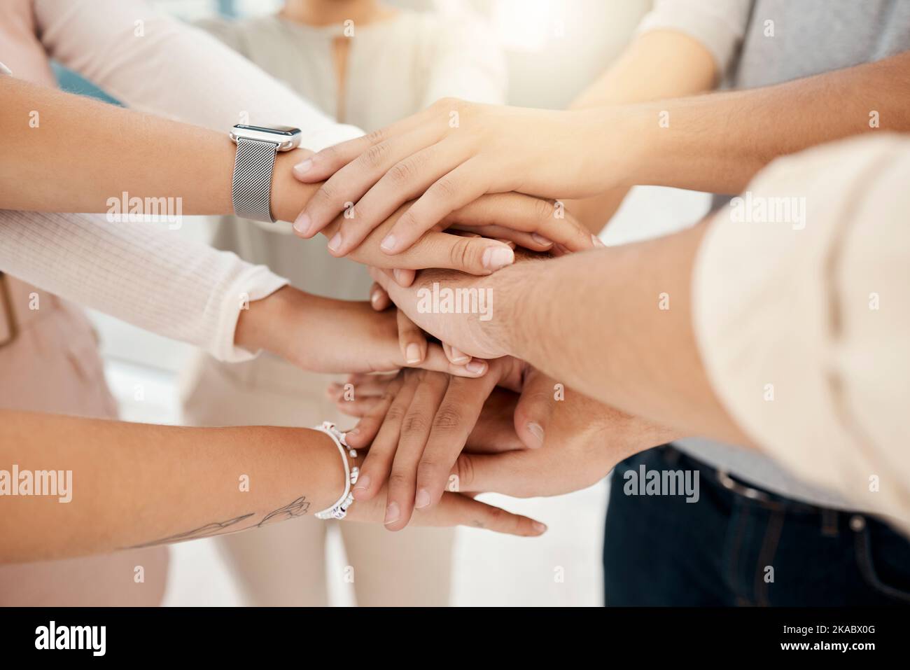 Stacked hands, team building and employee teamwork with business ...