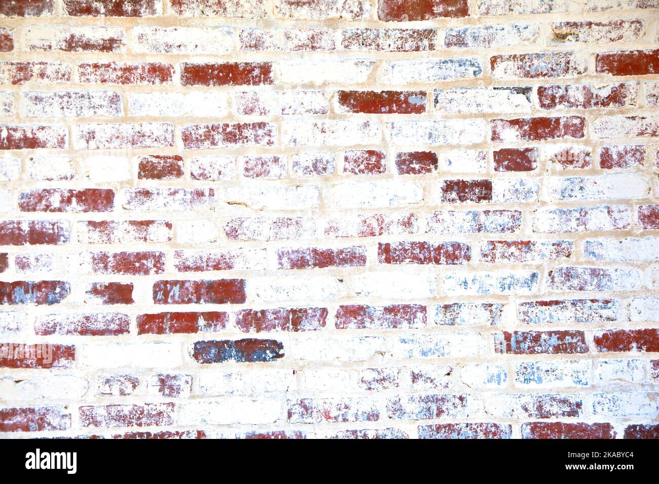 old red brick wall over painted by white Stock Photo - Alamy