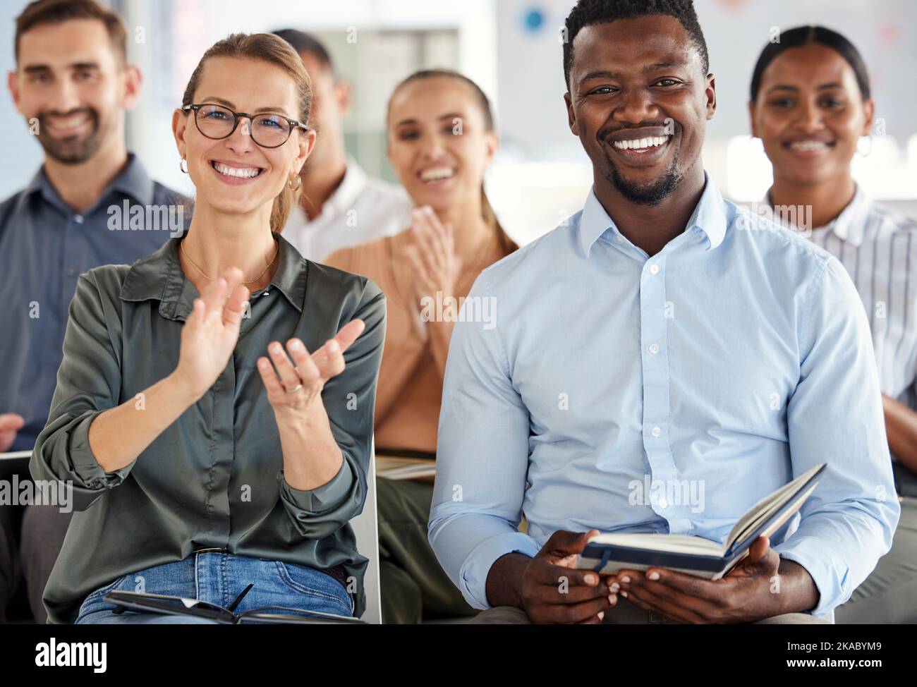 Business people, smile and applause for workshop training, conference or presentation at the ...