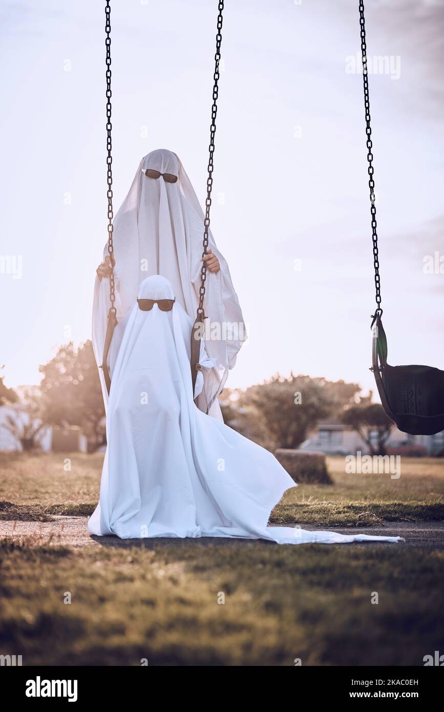 Halloween, costume and ghost couple at park, kid enjoy scary holiday ...
