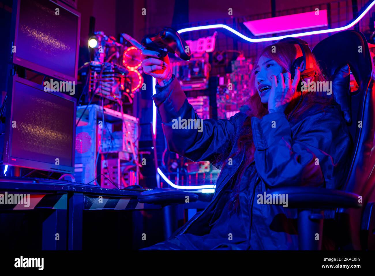 Gamer using joystick controller for virtual tournament plays online ...